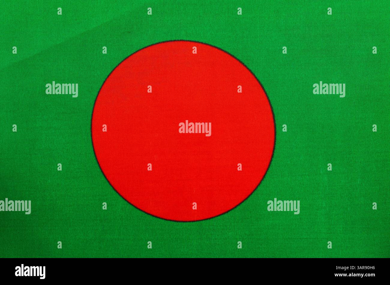 The flag of Bangladesh features a green background with a bold red ...