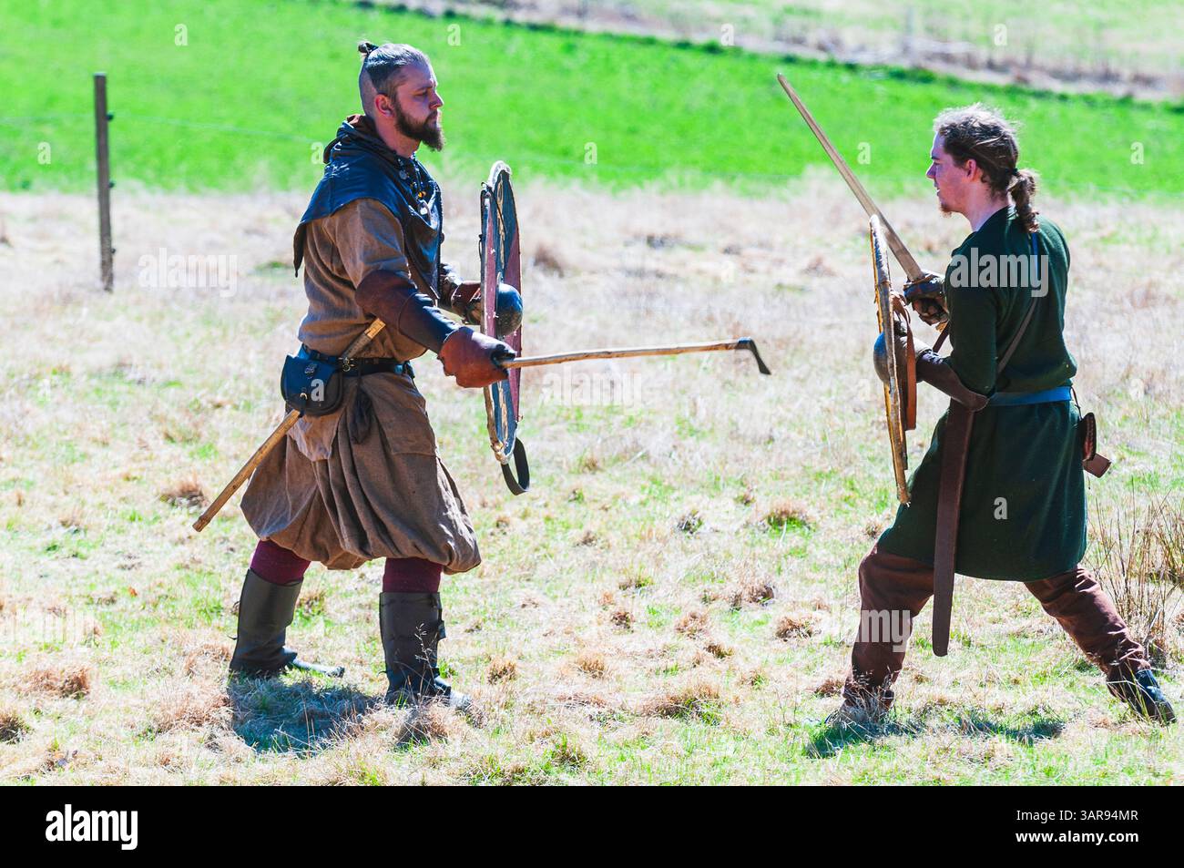 Two Vikings clash in an open field in Sweden, showcasing their combat ...
