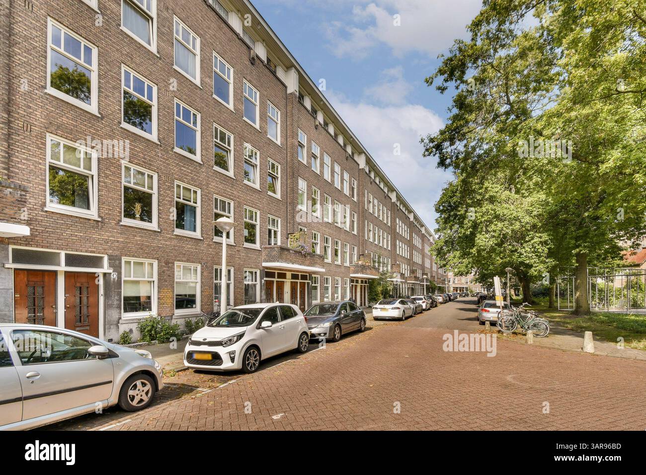 A picturesque street featuring modern urban buildings alongside vibrant ...