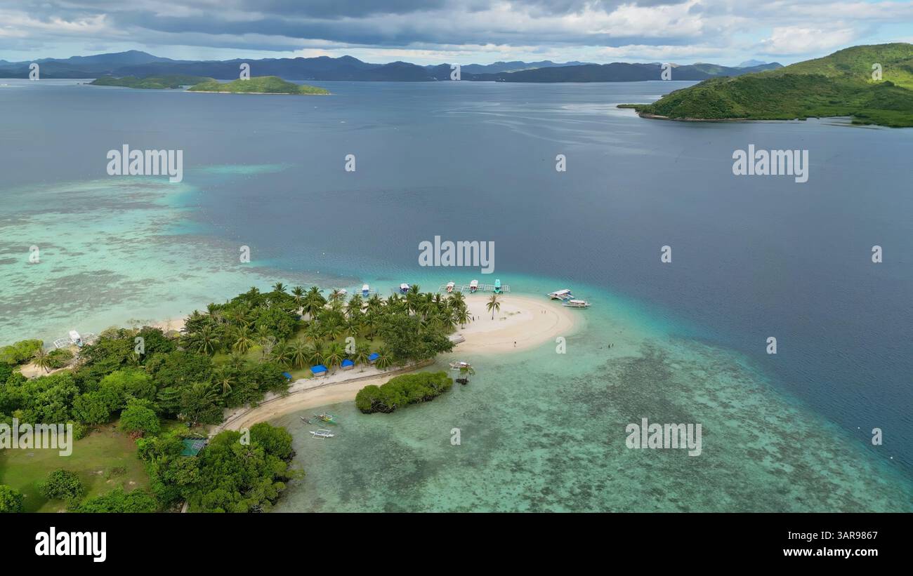 Small tropical island surrounded by distant islands Stock Photo - Alamy