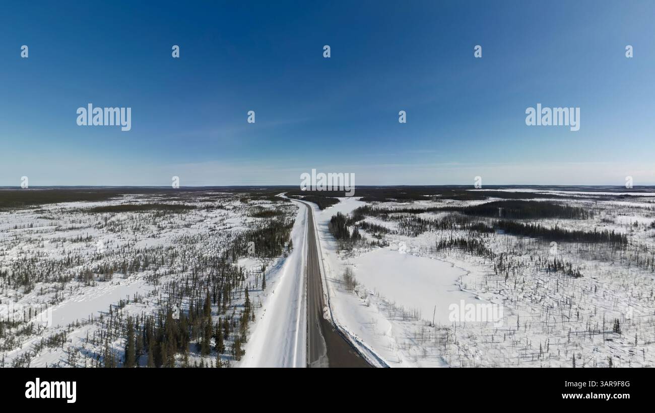 An aerial view of the MacKenzie Highway in winter near Behchoko in ...