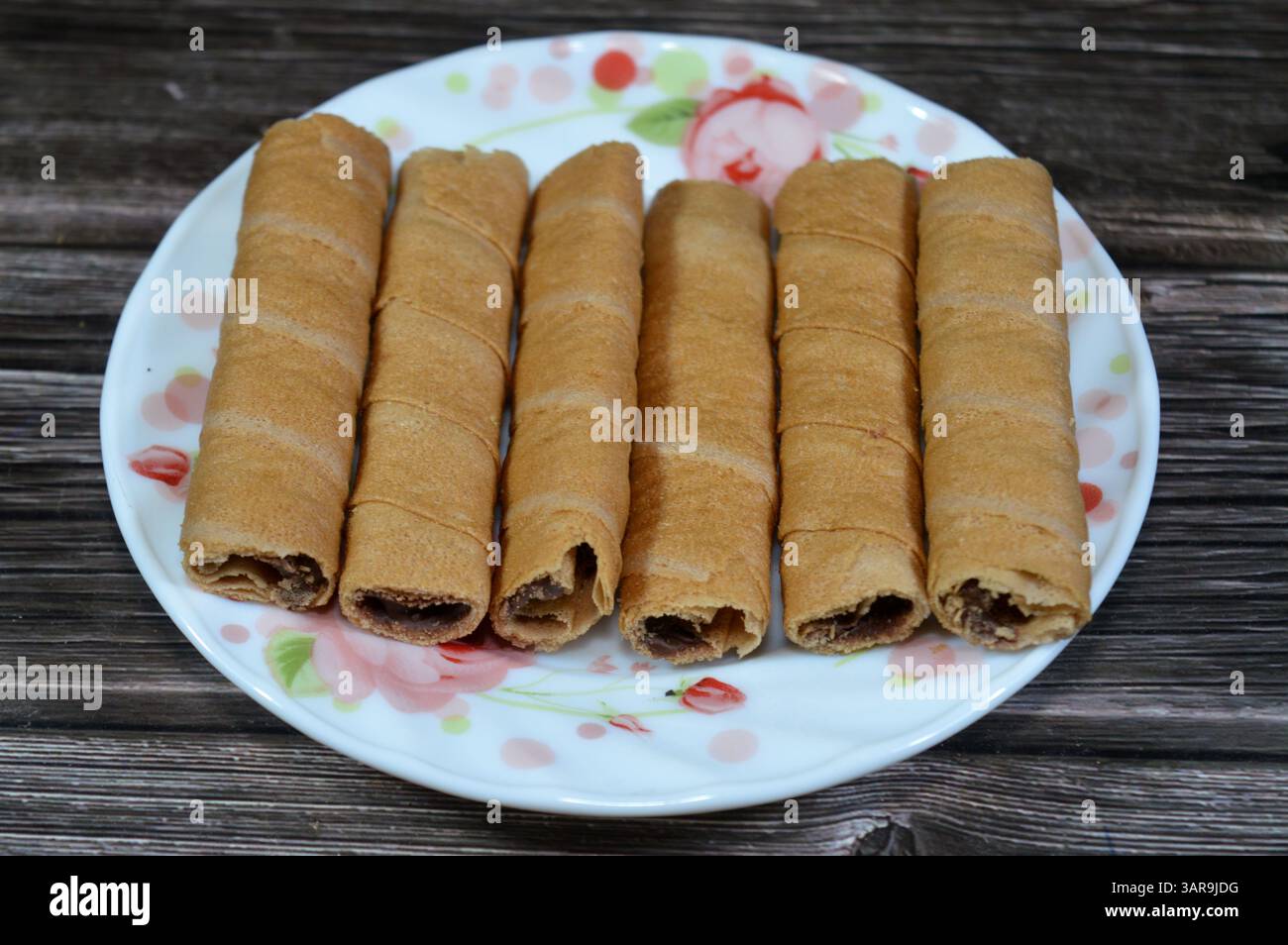 Rolled wafers filled with hazelnut chocolate paste cream, wafer rolls ...
