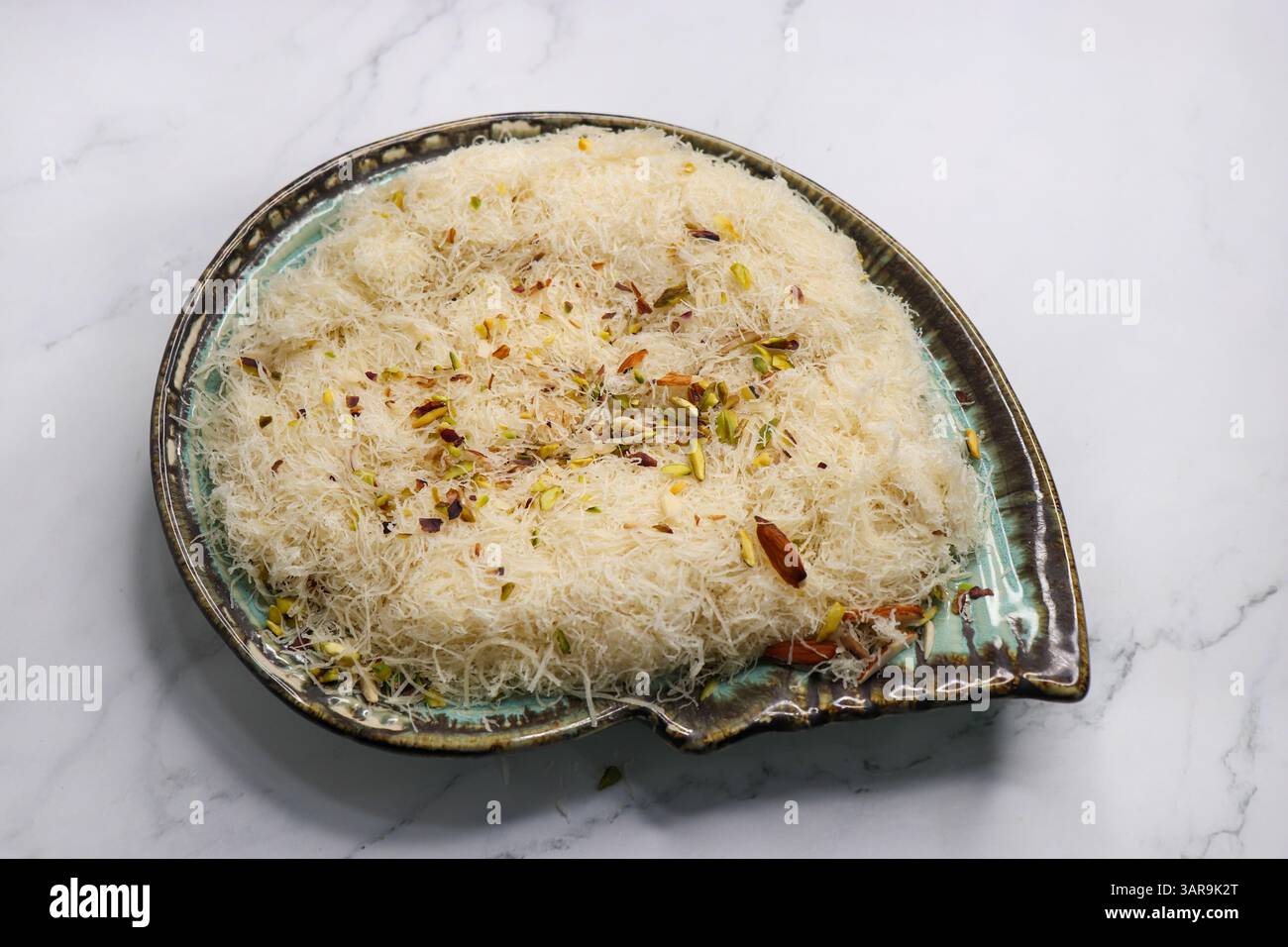 Closeup of Sutarfeni, a traditional Indian sweet made from fine sev ...
