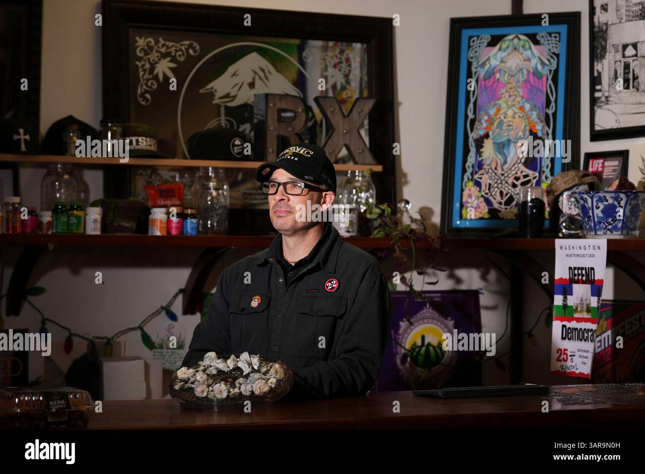 Marine Corps combat veteran Matt Metzger poses for a portrait with a ...