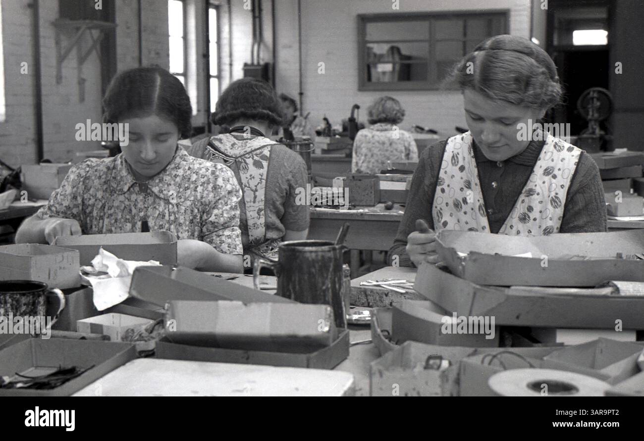 1930s, historical, two young women wearing flower patterned pinafores ...