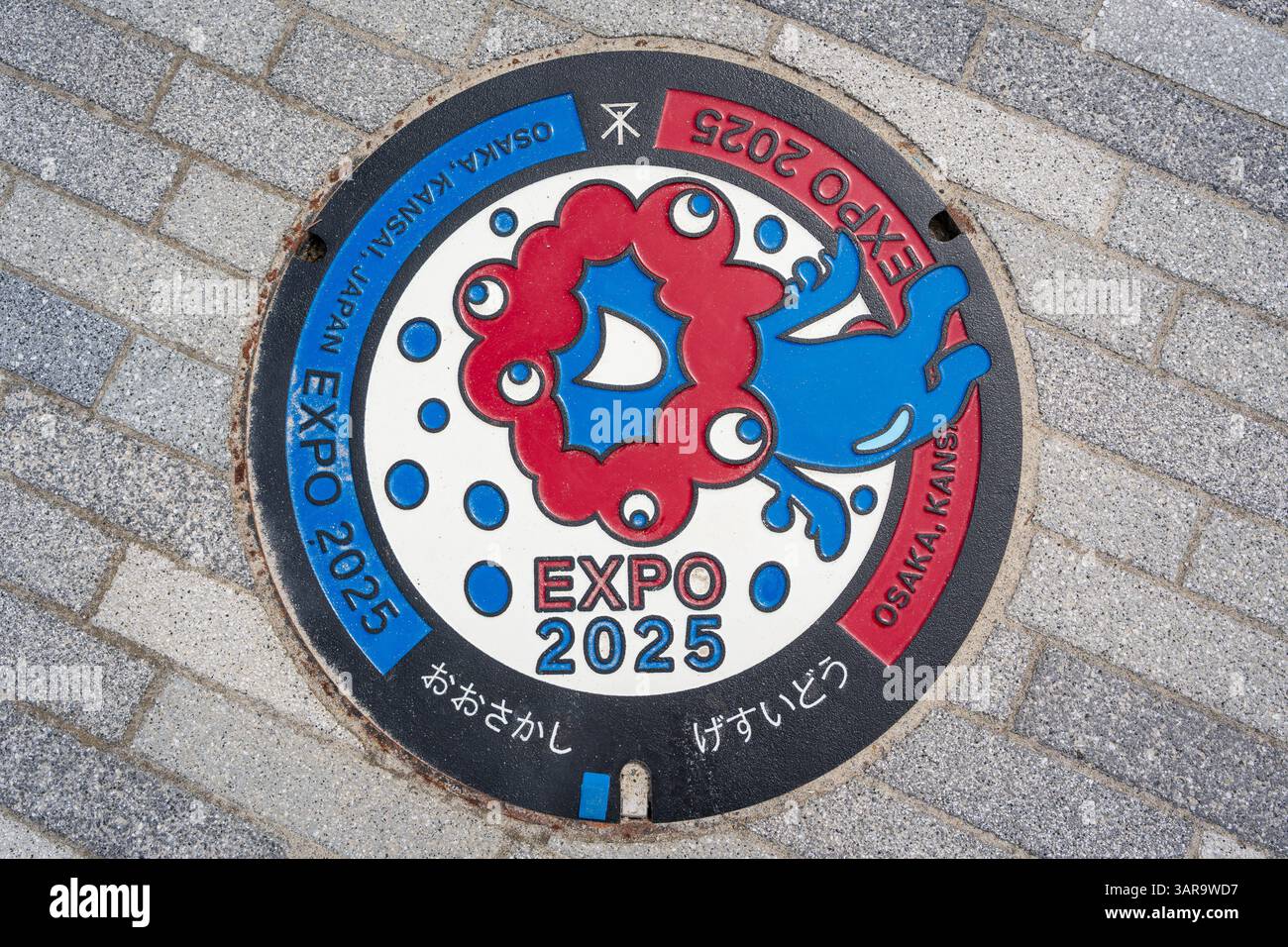 Osaka, Japan - April 16 2025 : Manhole cover with a colourful image of ...