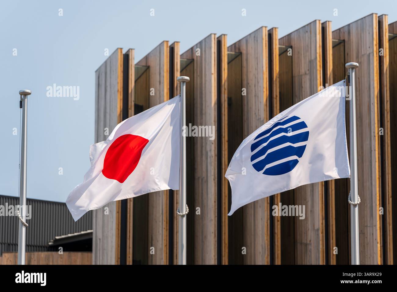 Japanese national flag (Nisshoki) and BIE flag flying outside the Japan ...