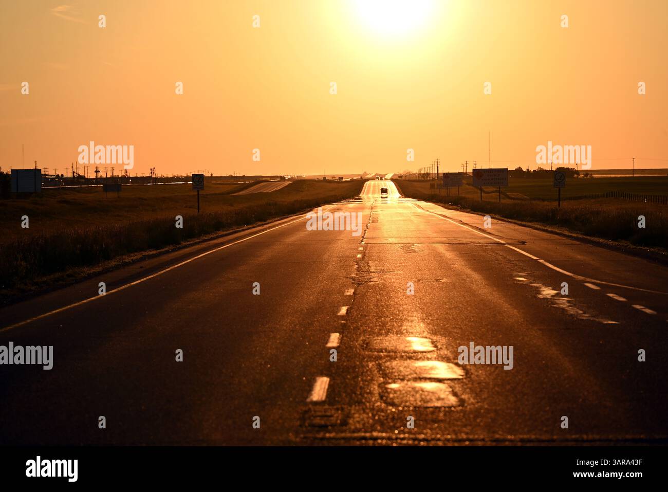 The transcanadian highway number 1 at sunset near the town of Moose Jaw ...
