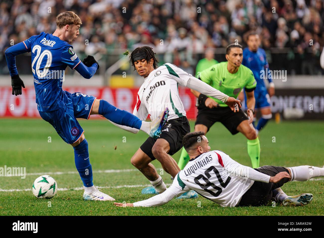 Cole Palmer (L) of Chelsea FC, Maximillian Maxi Oyedele (C) of Legia ...