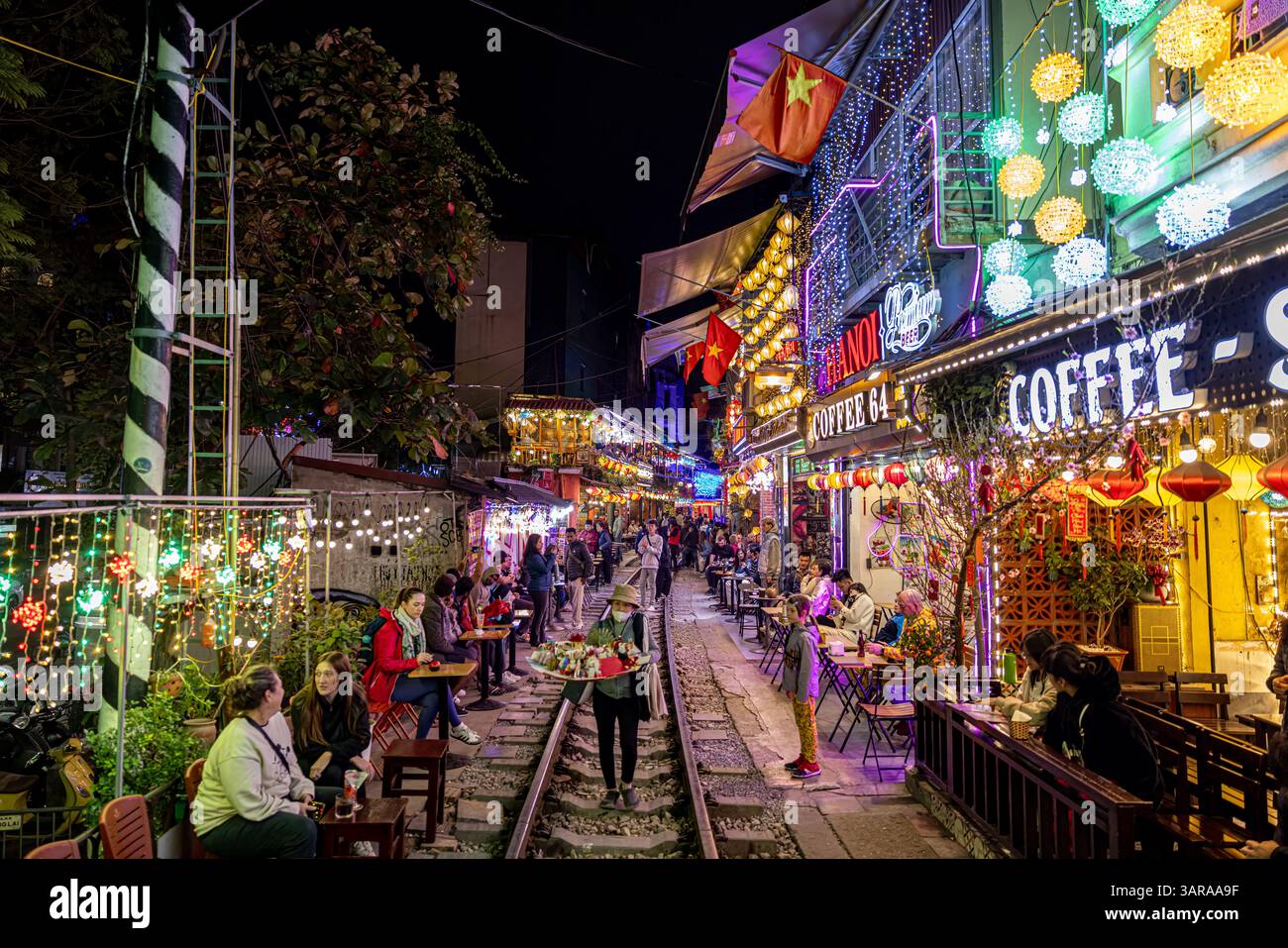 Train street at night, Hanoi, Vietnam Stock Photo - Alamy
