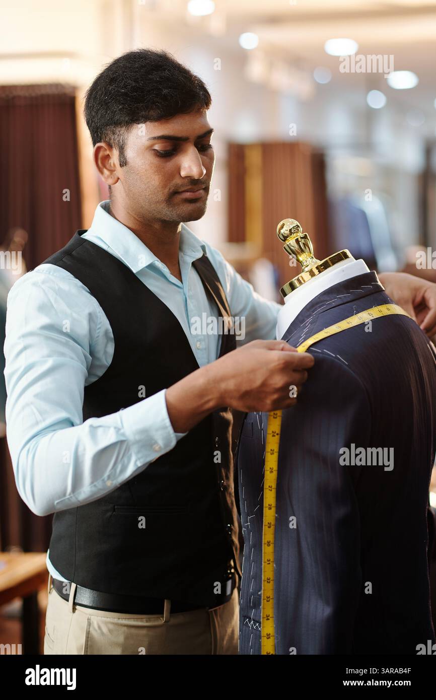 Portrait of Indian Man woking in taylor shop Stock Photo - Alamy