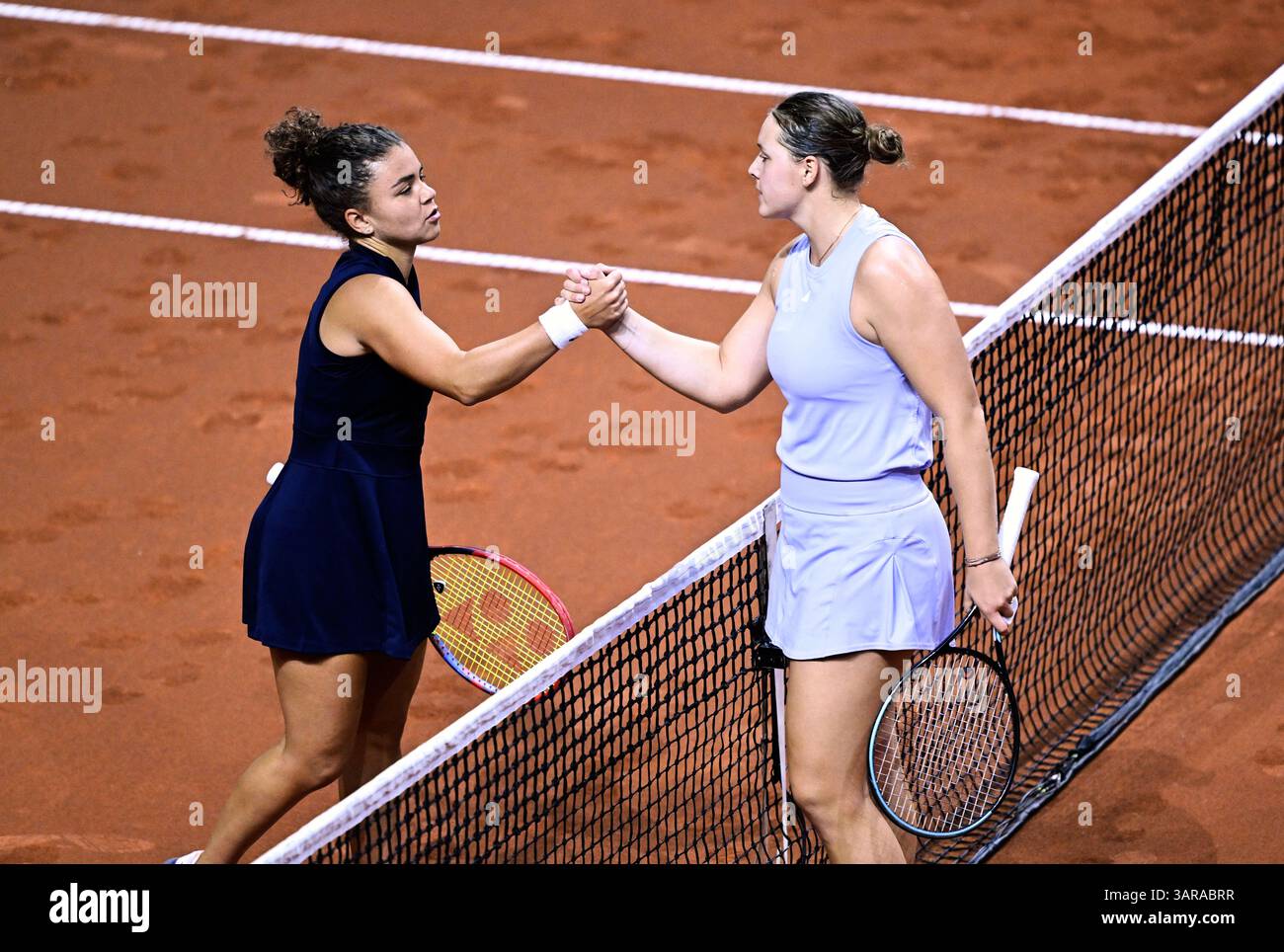 Italy's Jasmine Paolini, left, and Germany's Jule Niemeier shake hands ...