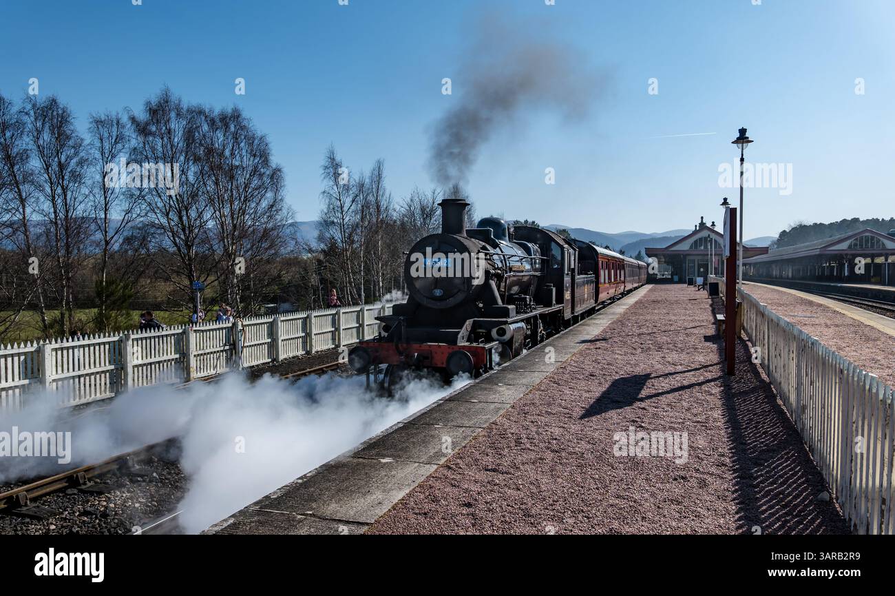 Heritage Strathspey steam railway engine departing from Aviemore train ...