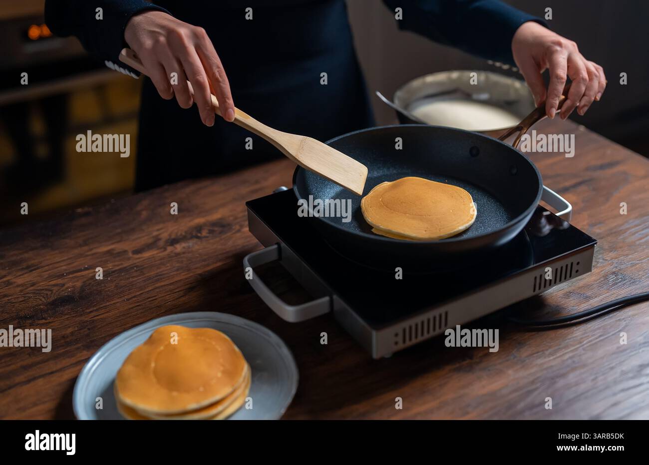 Woman making dough pancakes hi-res stock photography and images - Alamy