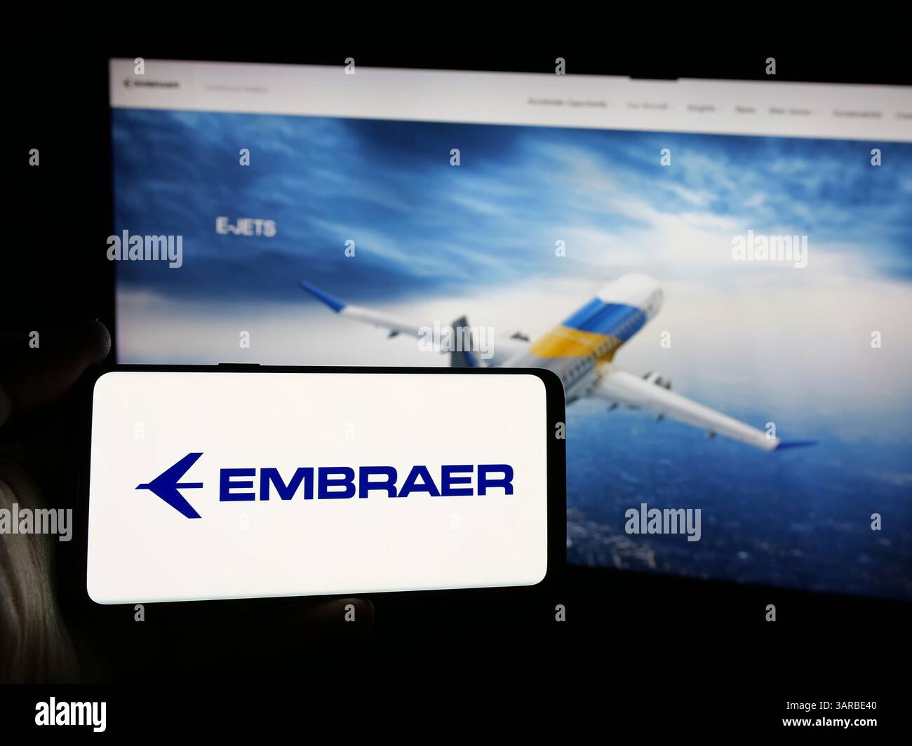 Stuttgart, Germany - 12-16-2024: Person holding smartphone with logo of ...