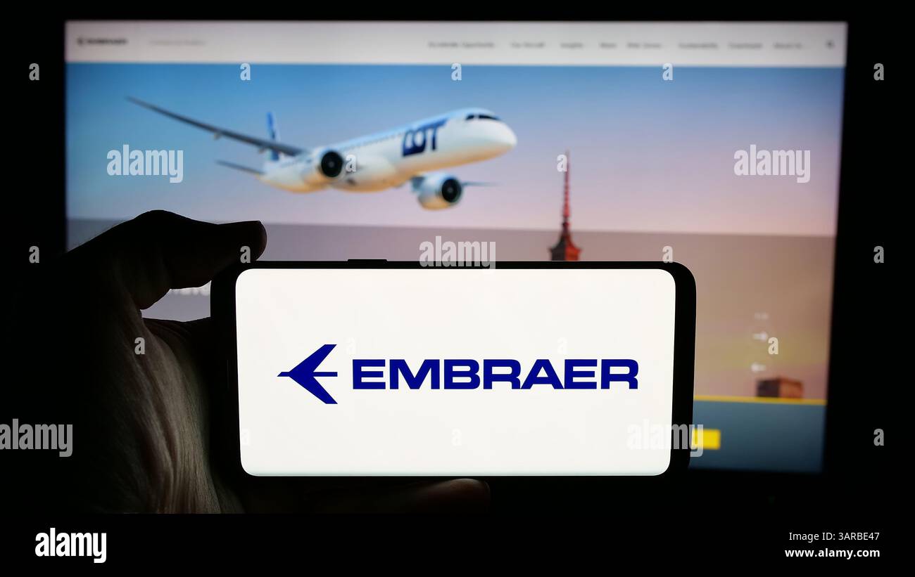 Stuttgart, Germany - 12-16-2024: Person holding cellphone with logo of ...