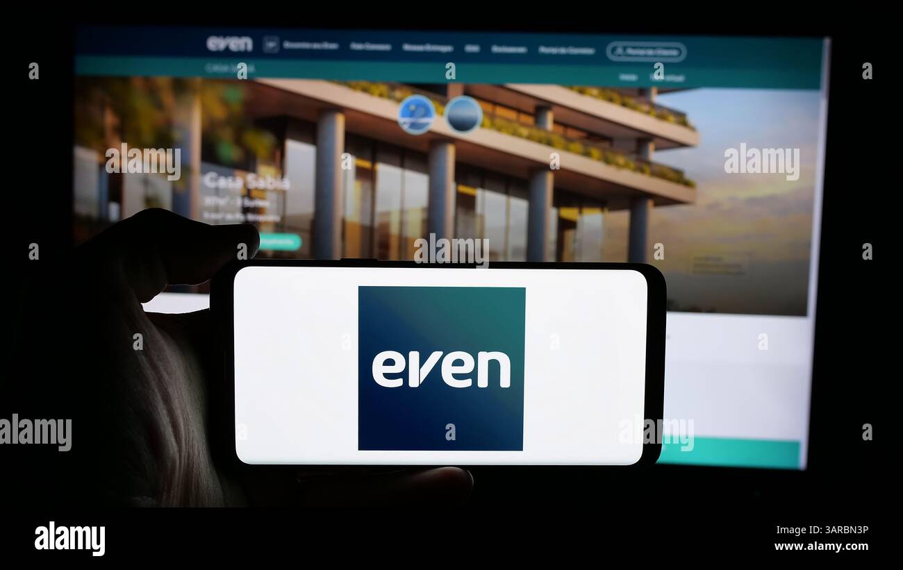 Stuttgart, Germany - 12-18-2024: Person holding cellphone with logo of ...