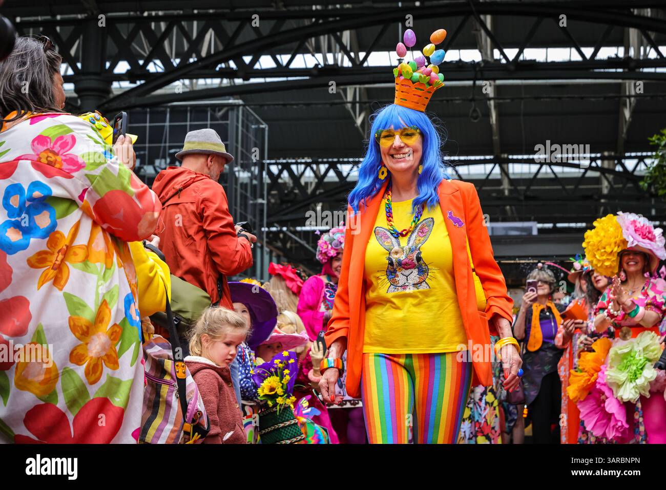 London, UK. 17th Apr, 2025. Participants show off their colourful ...