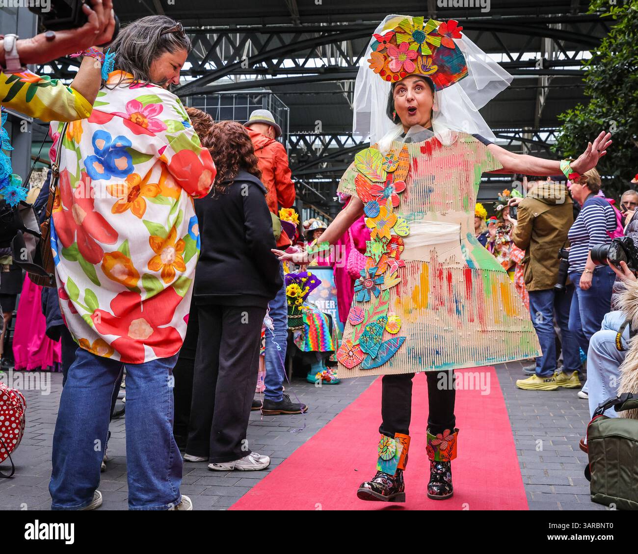 London, UK. 17th Apr, 2025. Participants show off their colourful ...