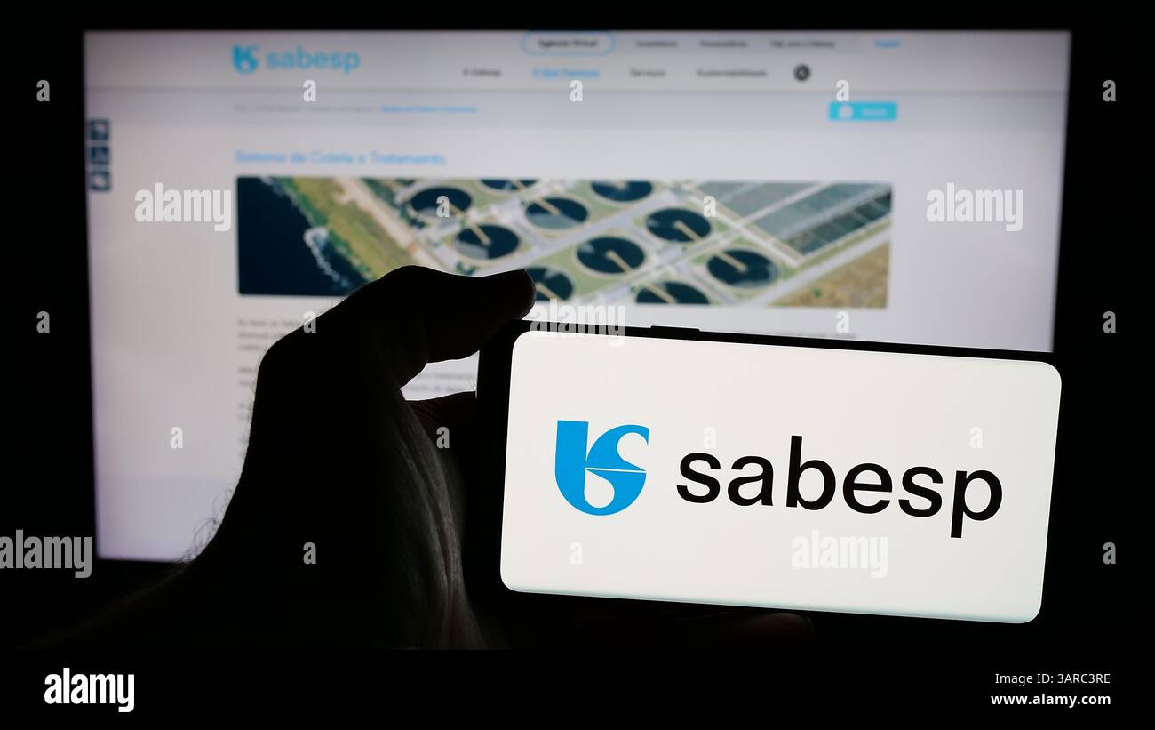 Stuttgart, Germany - 12-19-2024: Person holding mobile phone with logo ...