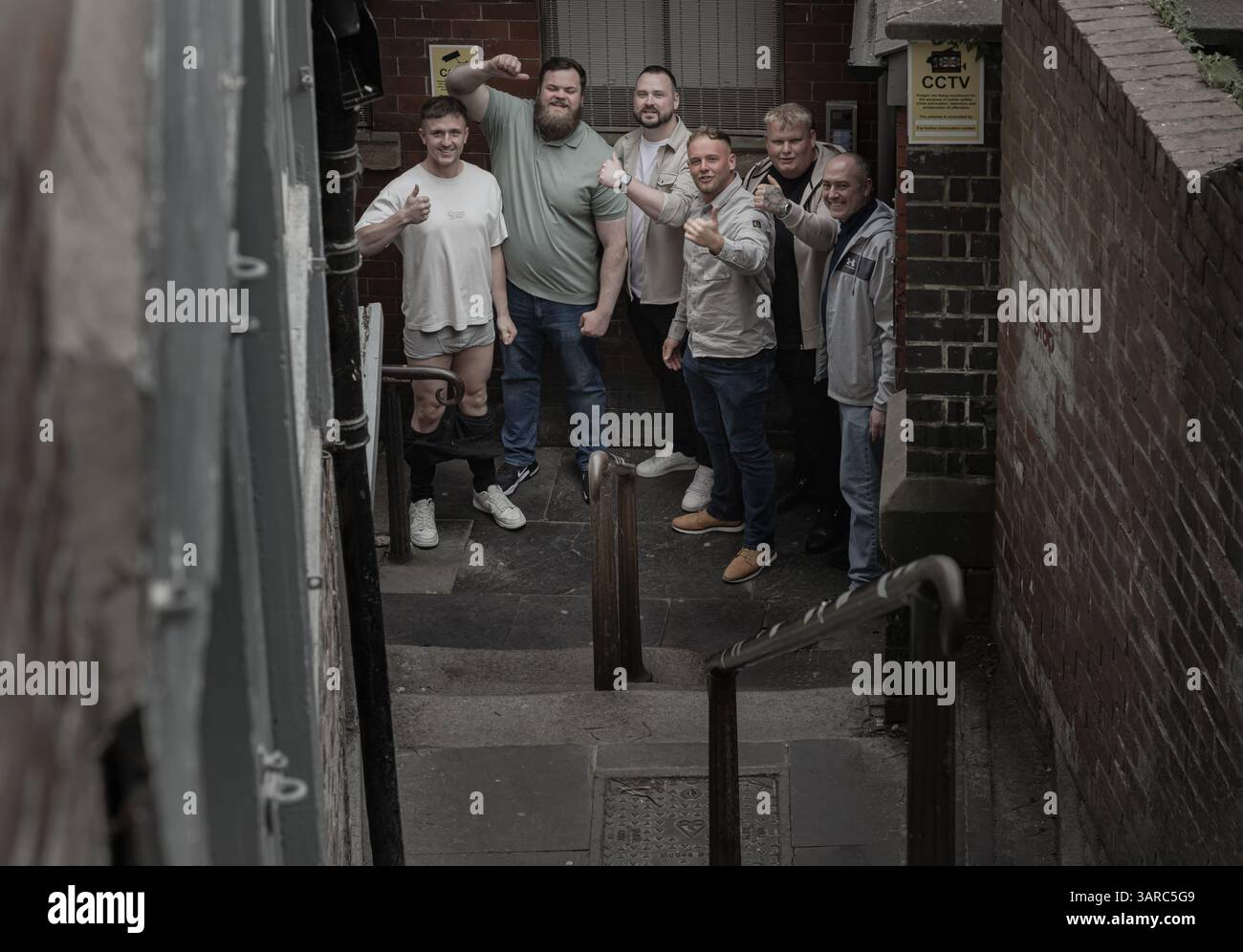 Newcastle, UK - Apr 12, 2025 - Group of cheerful male friends gathered ...