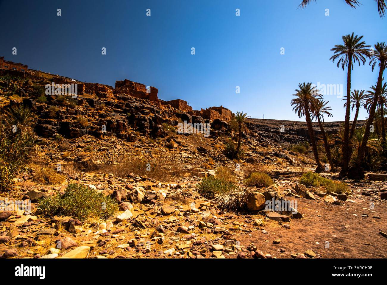 arid riverbed of the Handour river between the mountains parched by the ...