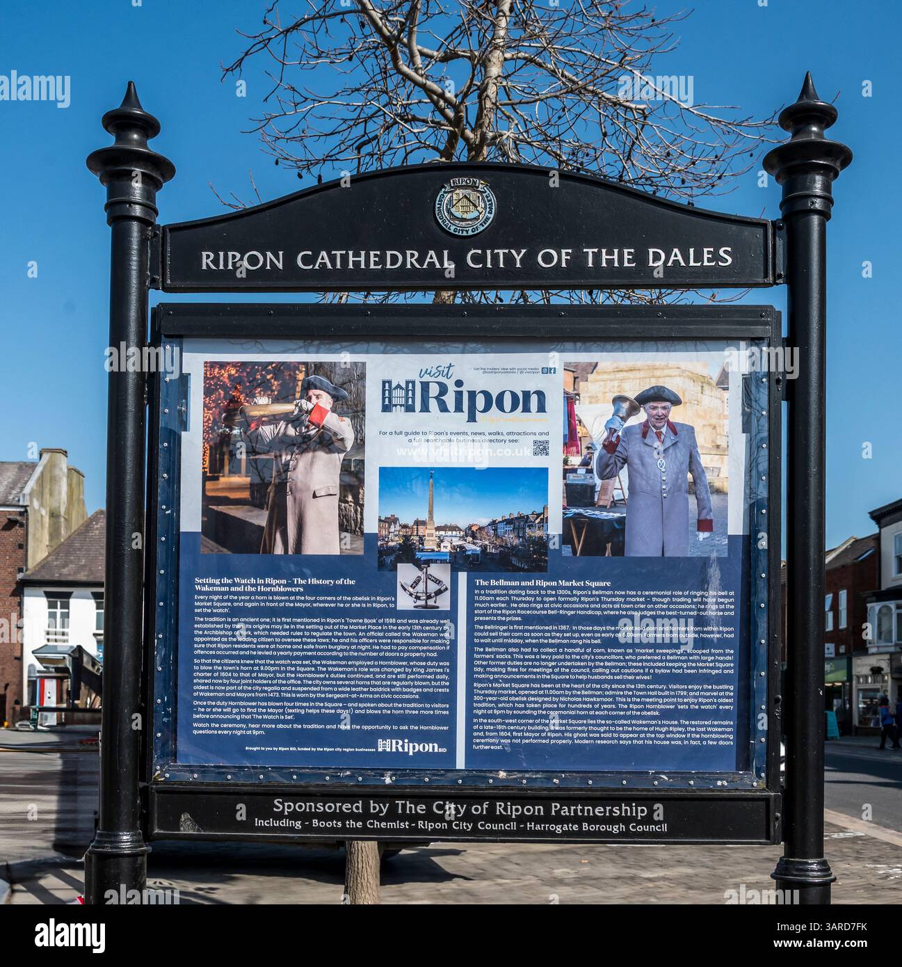 Street scene with tourist information panel on the Market Square in the City of Ripon famous for ...