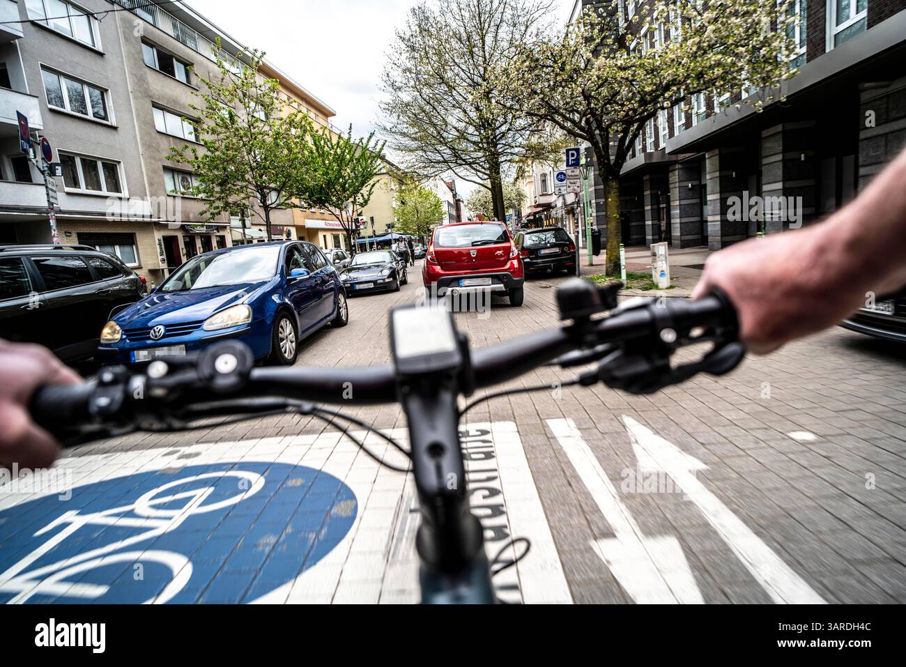 Cycling in the city, inner-city road, cycle lane, bicycles have right ...