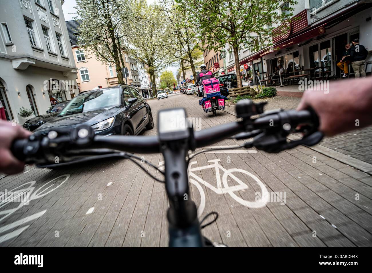 Cycling in the city, inner-city road, cycle lane, bicycles have right ...