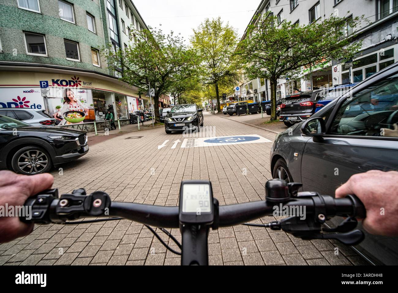 Cycling in the city, inner-city road, cycle lane, bicycles have right ...