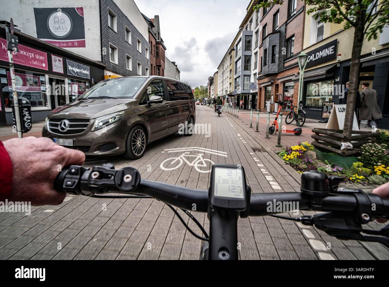 Cycling in the city, inner-city road, cycle lane, bicycles have right ...
