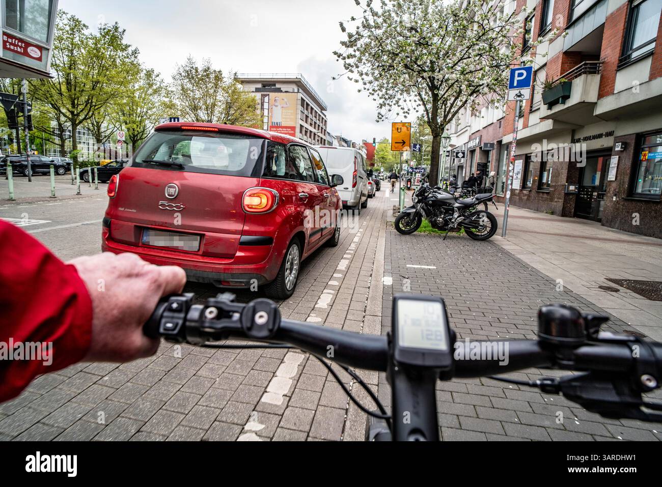 Cycling in the city, inner-city road, cycle lane, bicycles have right ...