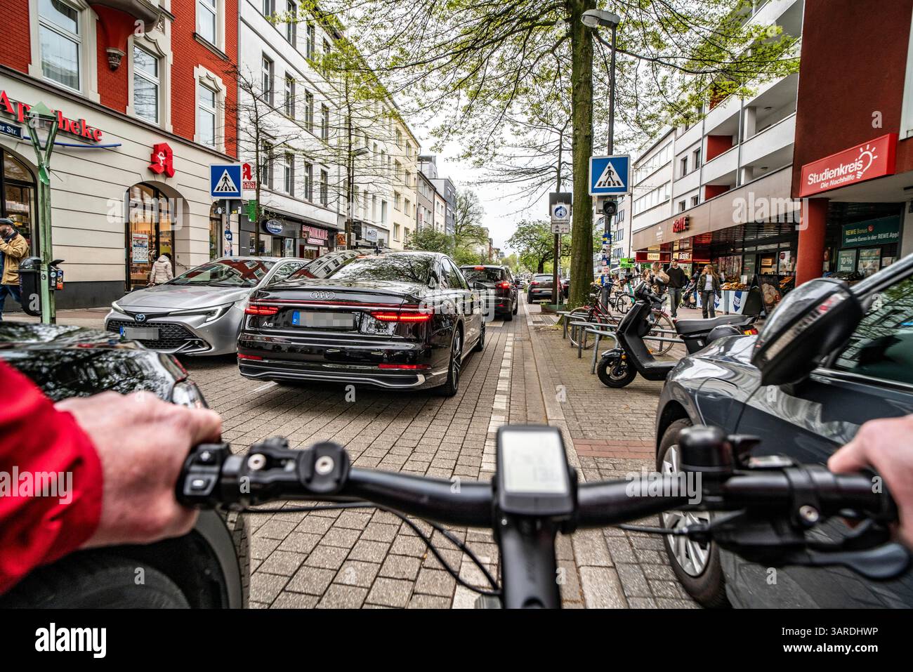 Cycling in the city, inner-city road, cycle lane, bicycles have right ...