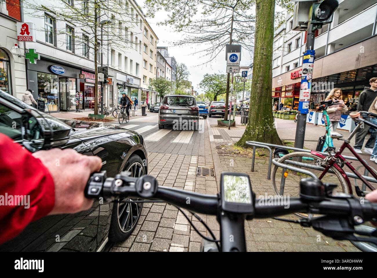Cycling in the city, inner-city road, cycle lane, bicycles have right ...