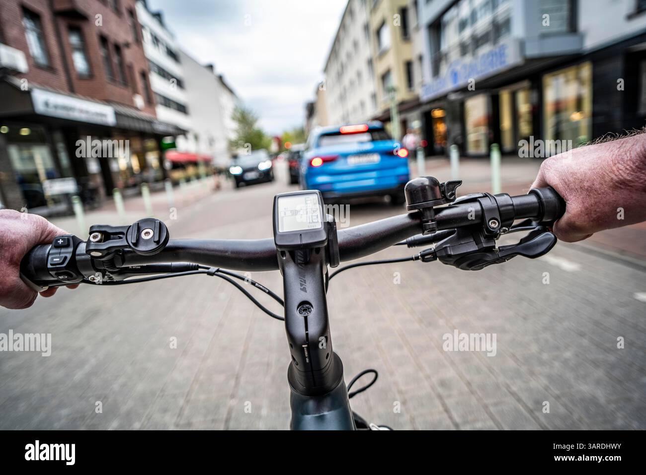 Cycling in the city, inner-city road, cycle lane, bicycles have right ...