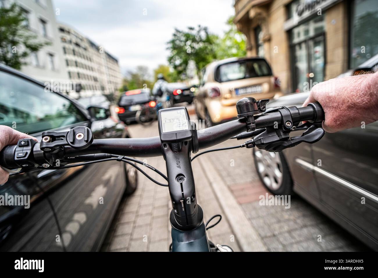 Cycling in the city, inner-city road, cycle lane, bicycles have right ...