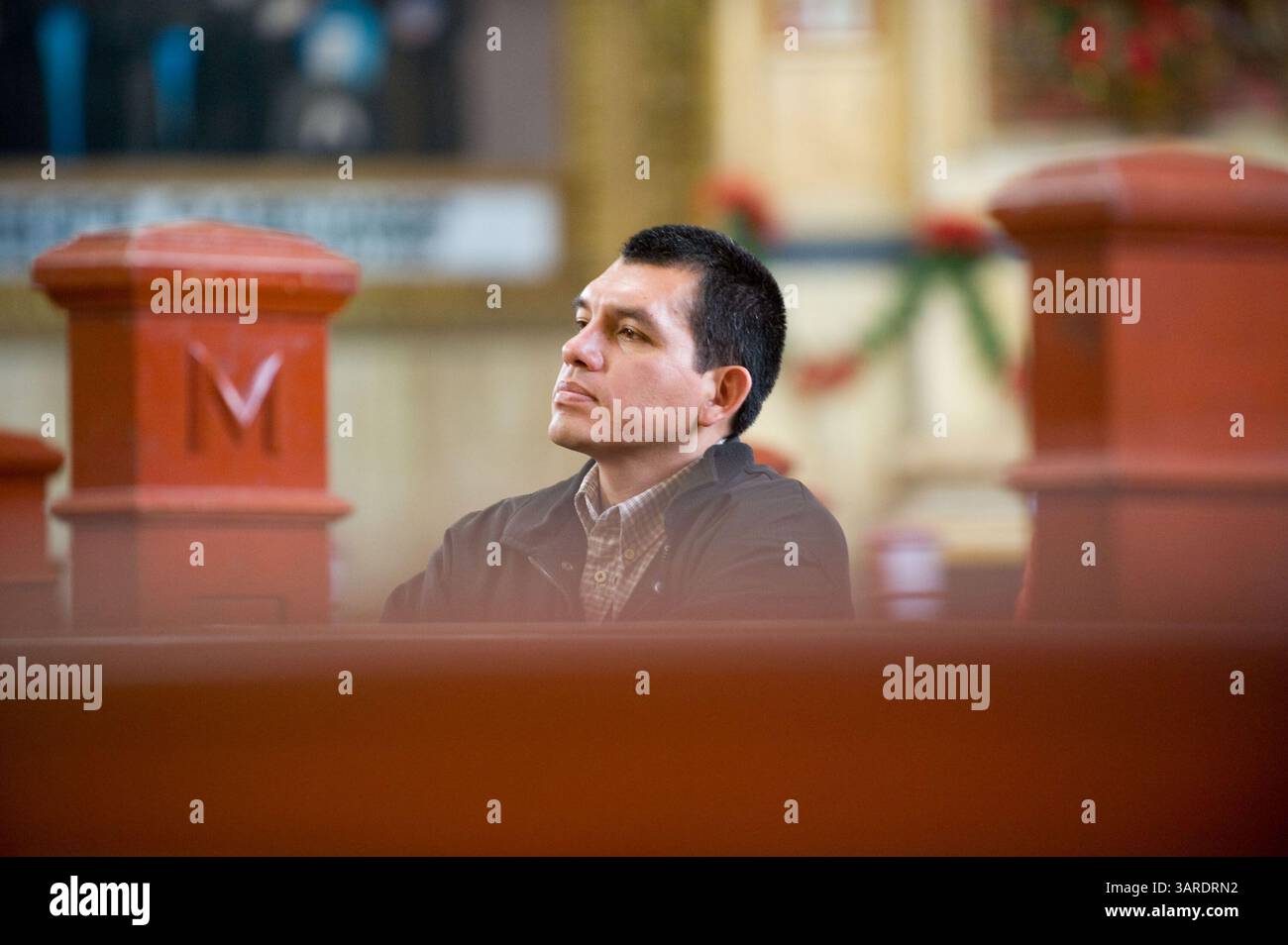 Dec 21, 2009 - Lima, Peru - A male congregation member prays during one ...