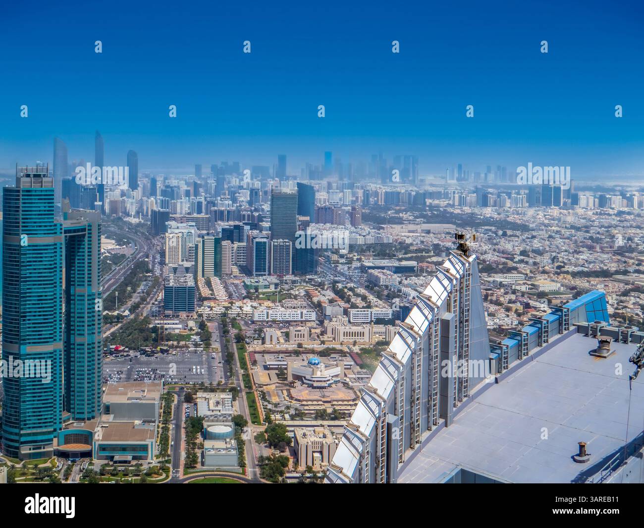 Abu Dhabi. UAE. Aerial cityscape of Al Reem Island at hazy morning ...