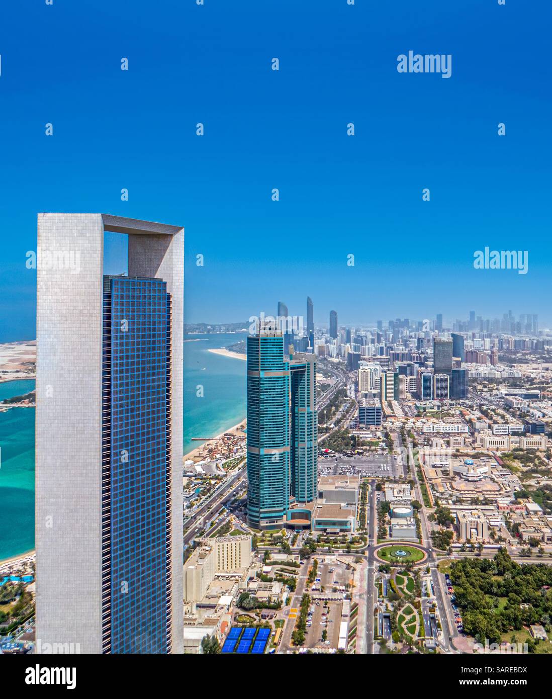 Abu Dhabi. UAE. Aerial cityscape of Al Reem Island at hazy morning ...