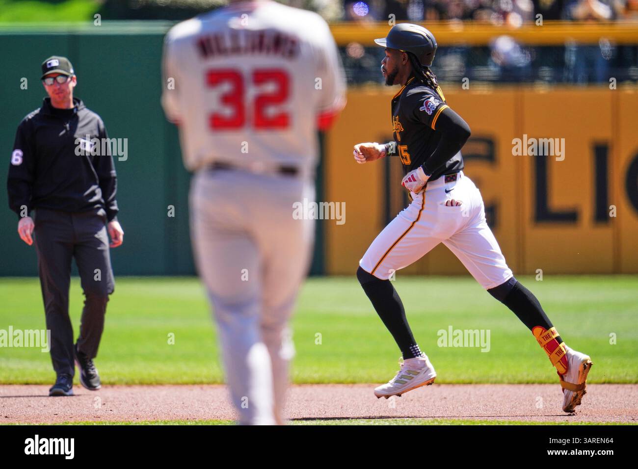 Pittsburgh Pirates' Oneil Cruz, right, rounds the bases after hitting a ...