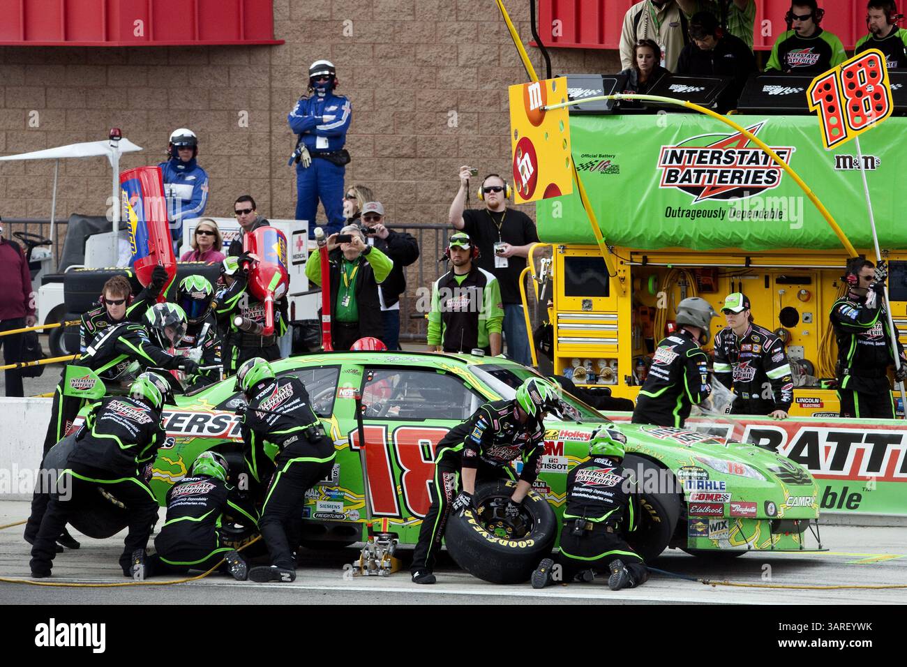 Fontana, CA - February 21, 2010: Kyle Busch makes a quick pit stop ...
