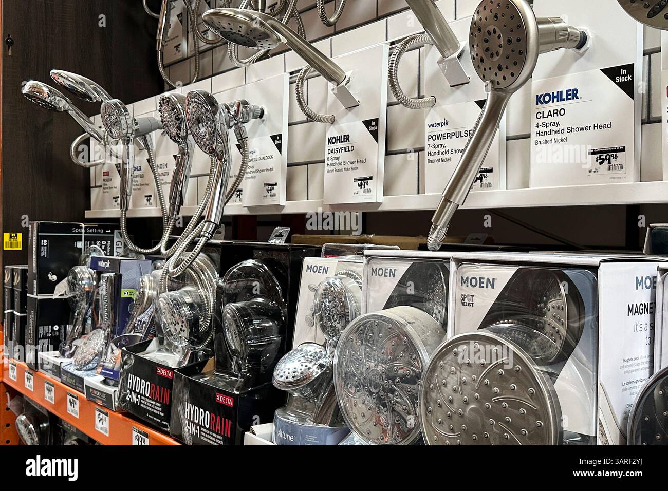 Shower heads on display at a Home Depot store Thursday, April 17, 2025 ...