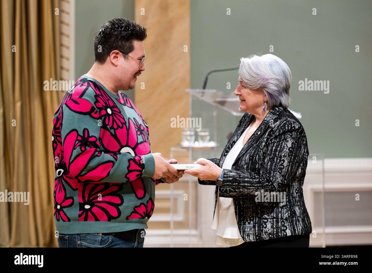 Gov. Gen. Mary Simon, right, presents Jordan Abel with the Governor ...