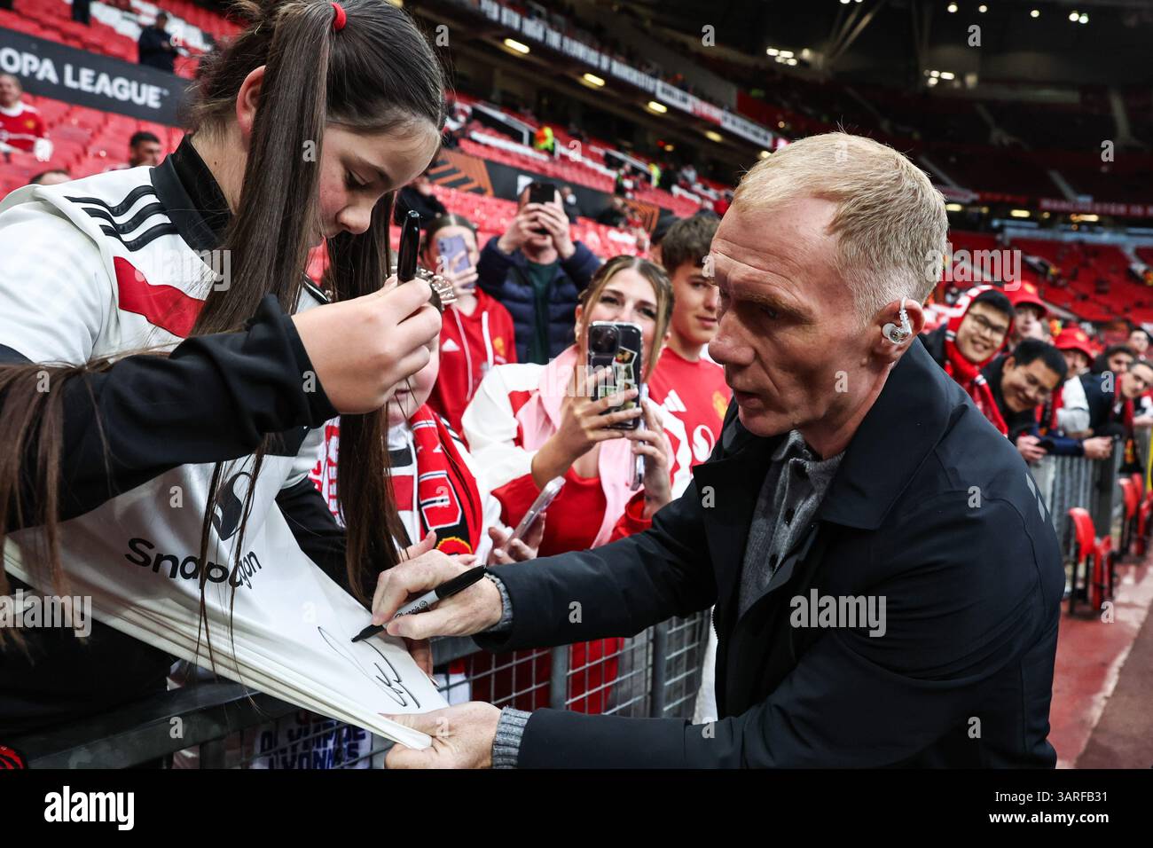 Paul Scholes former Manchester United player signs a fans shirt ahead ...