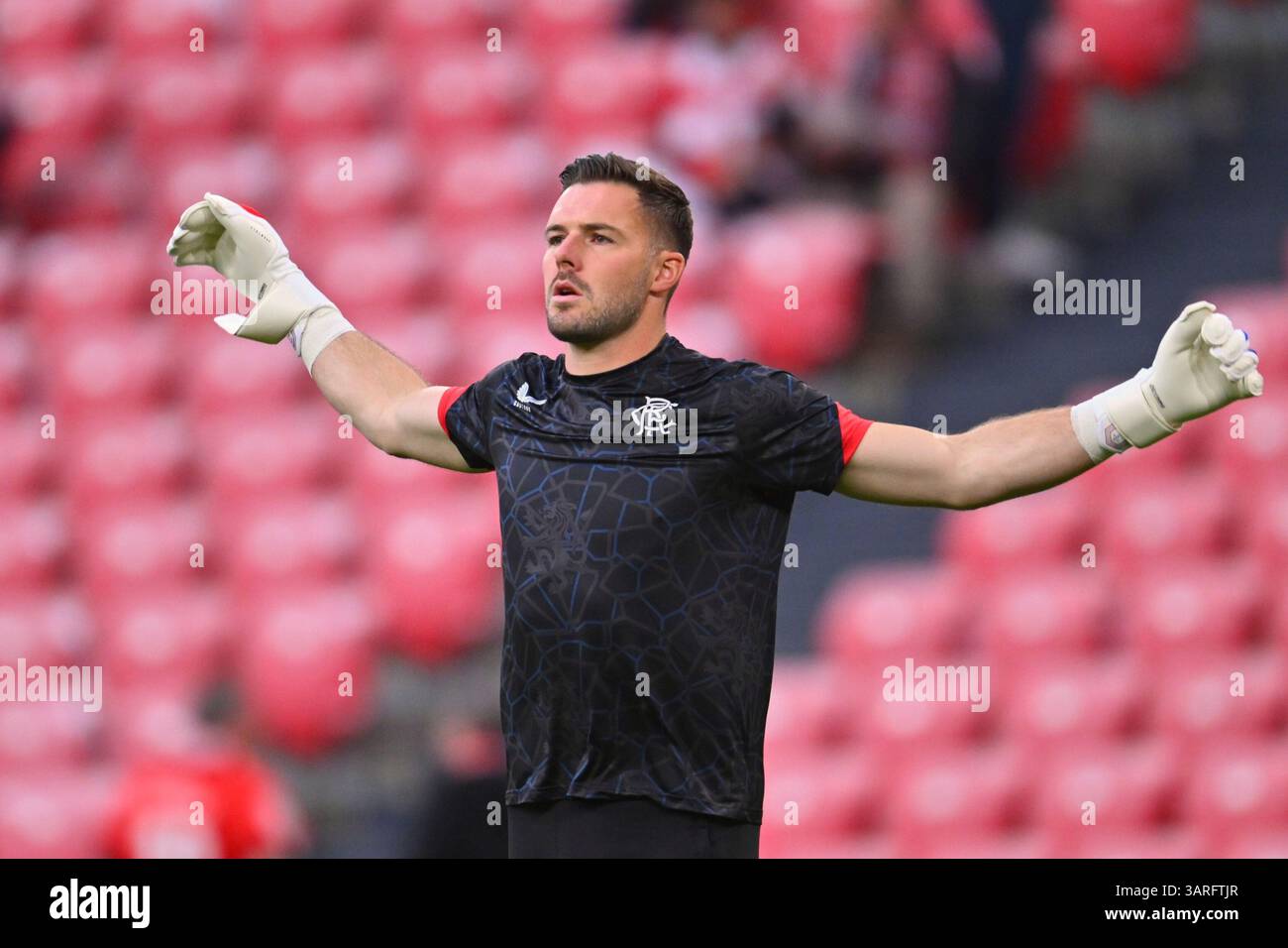 Rangers' goalkeeper Liam Kelly warms up before the Europa League ...