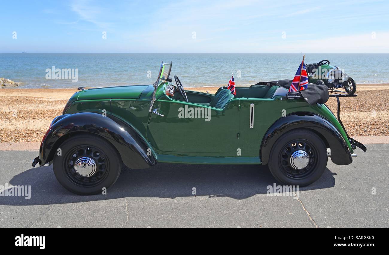 Classic Morris Eight parked on seafront promenade with sea in ...