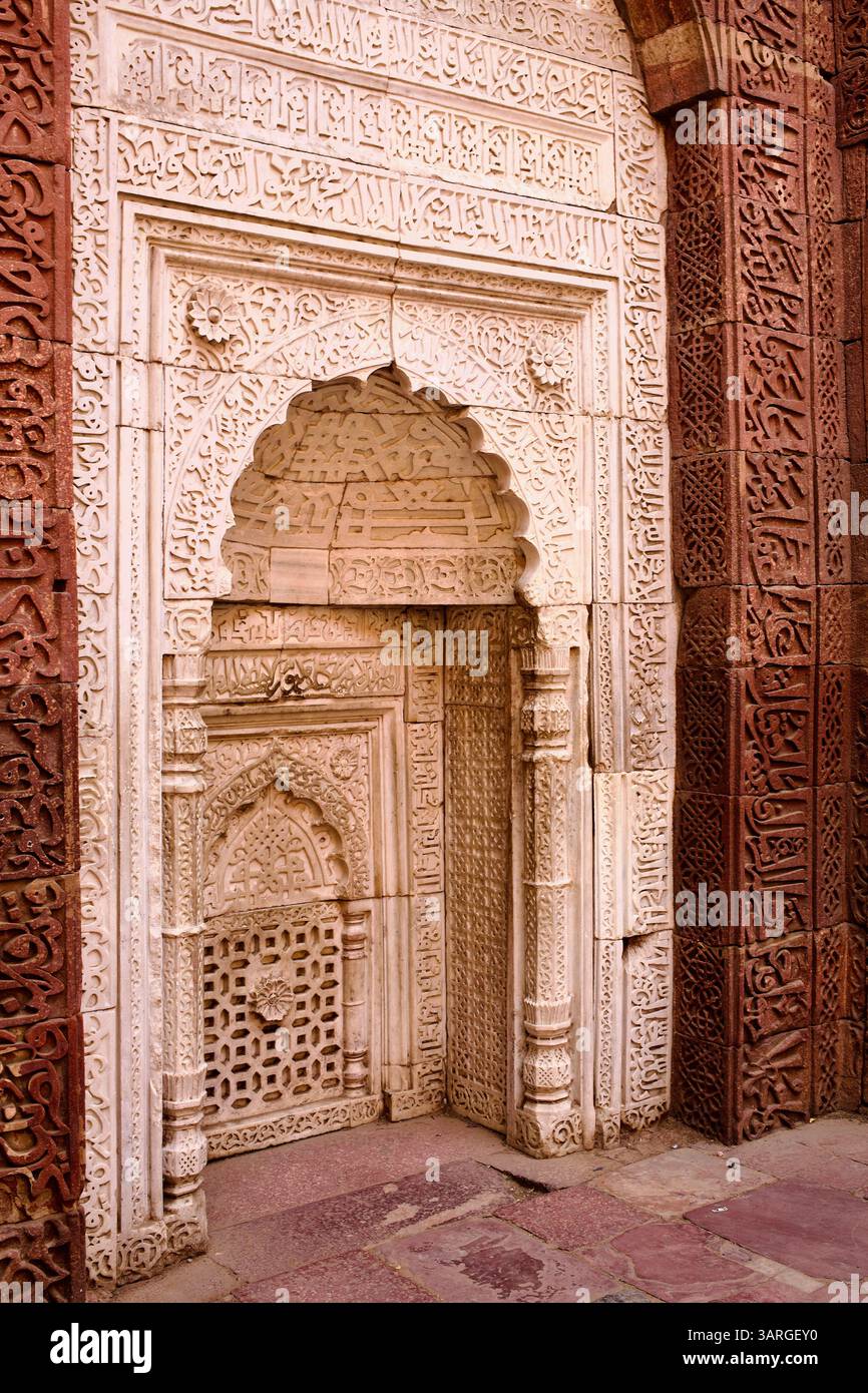 Ornately carved mihrab panel with Kufic calligraphy in Iltutmish’s tomb ...