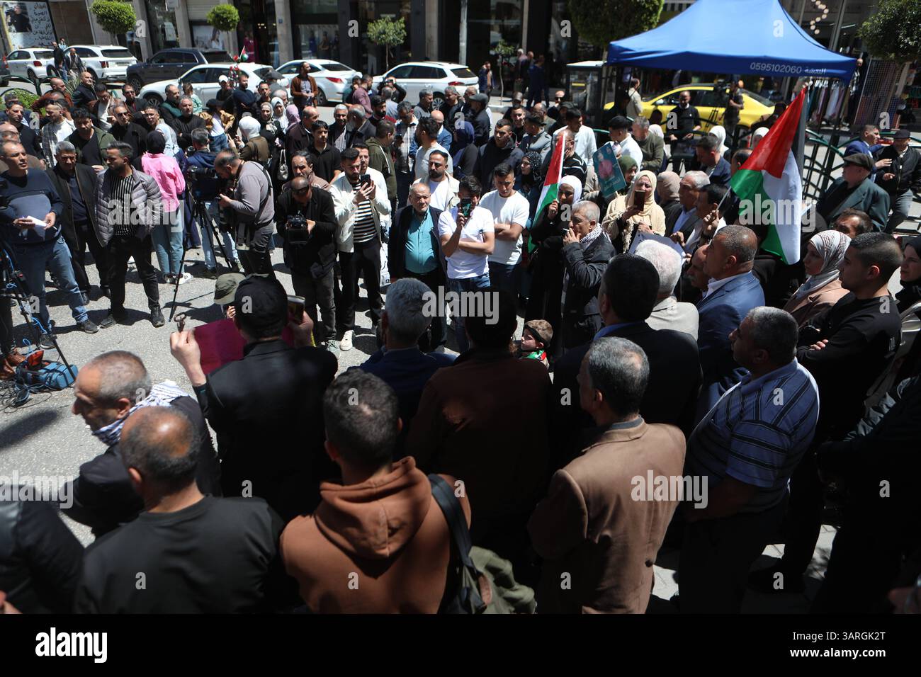 Demonstrators carry posters and portraits of Palestinian prisoners in ...