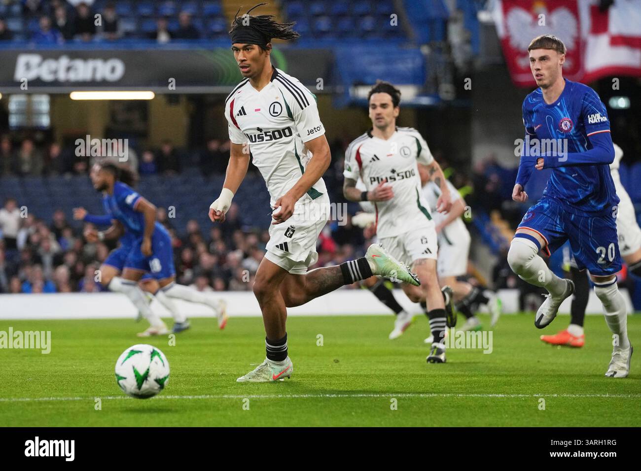 Legia's Maxi Oyedele runs with the ball during the Europa Conference ...