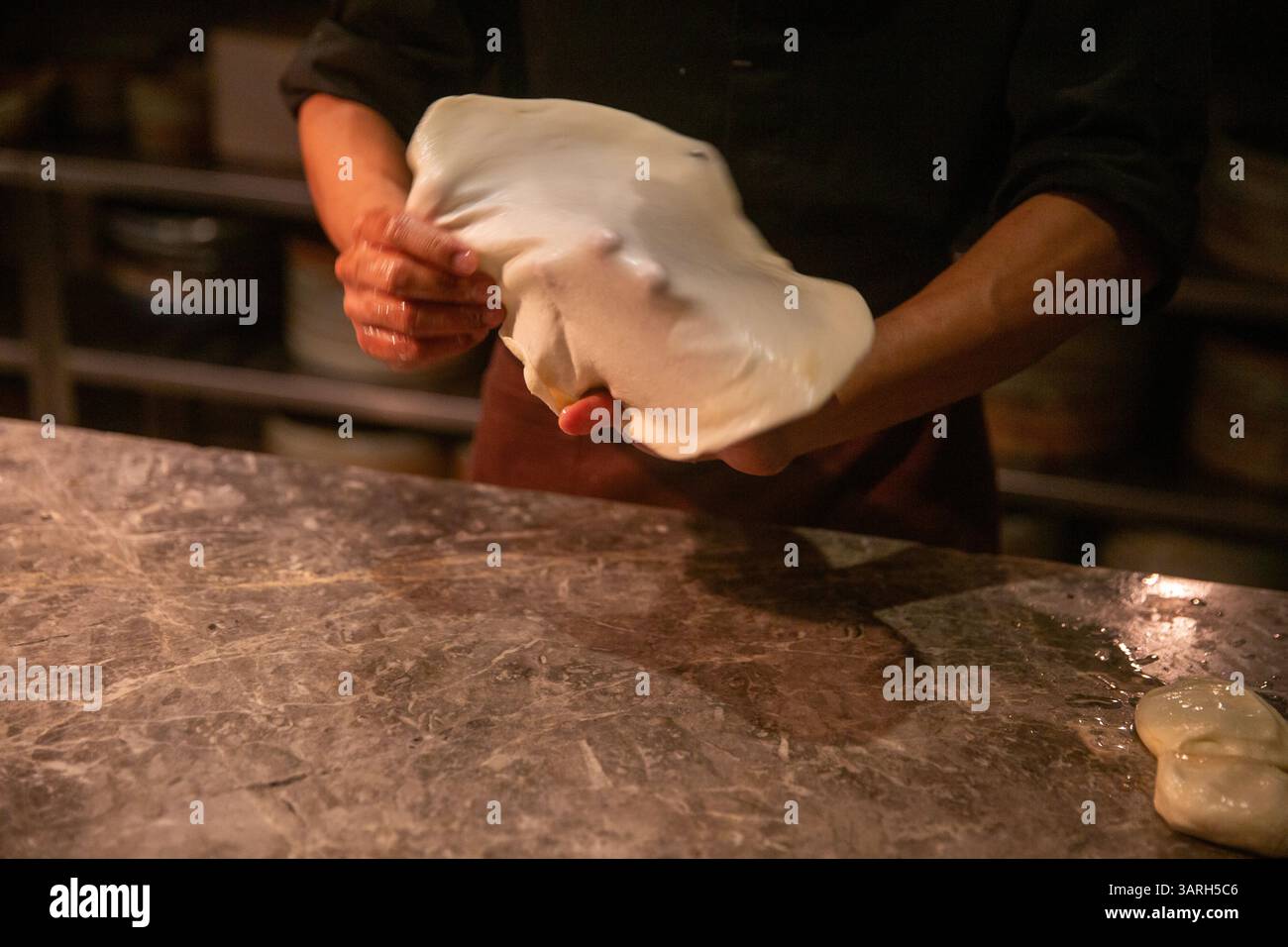 Sous chef preparing roti canai or paratha Stock Photo - Alamy